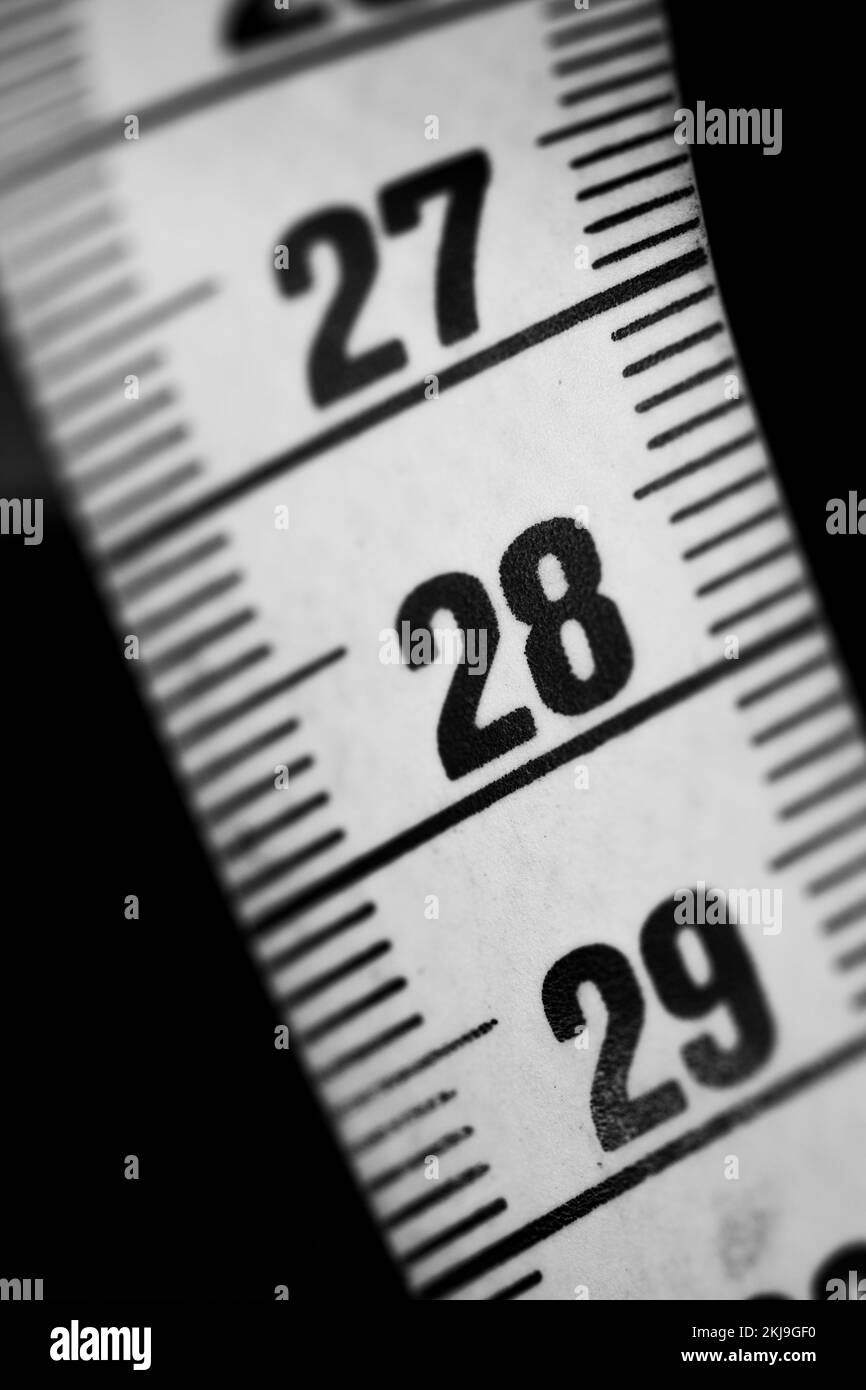 A vertical macro of measuring tape with numbers and ticks Stock Photo ...