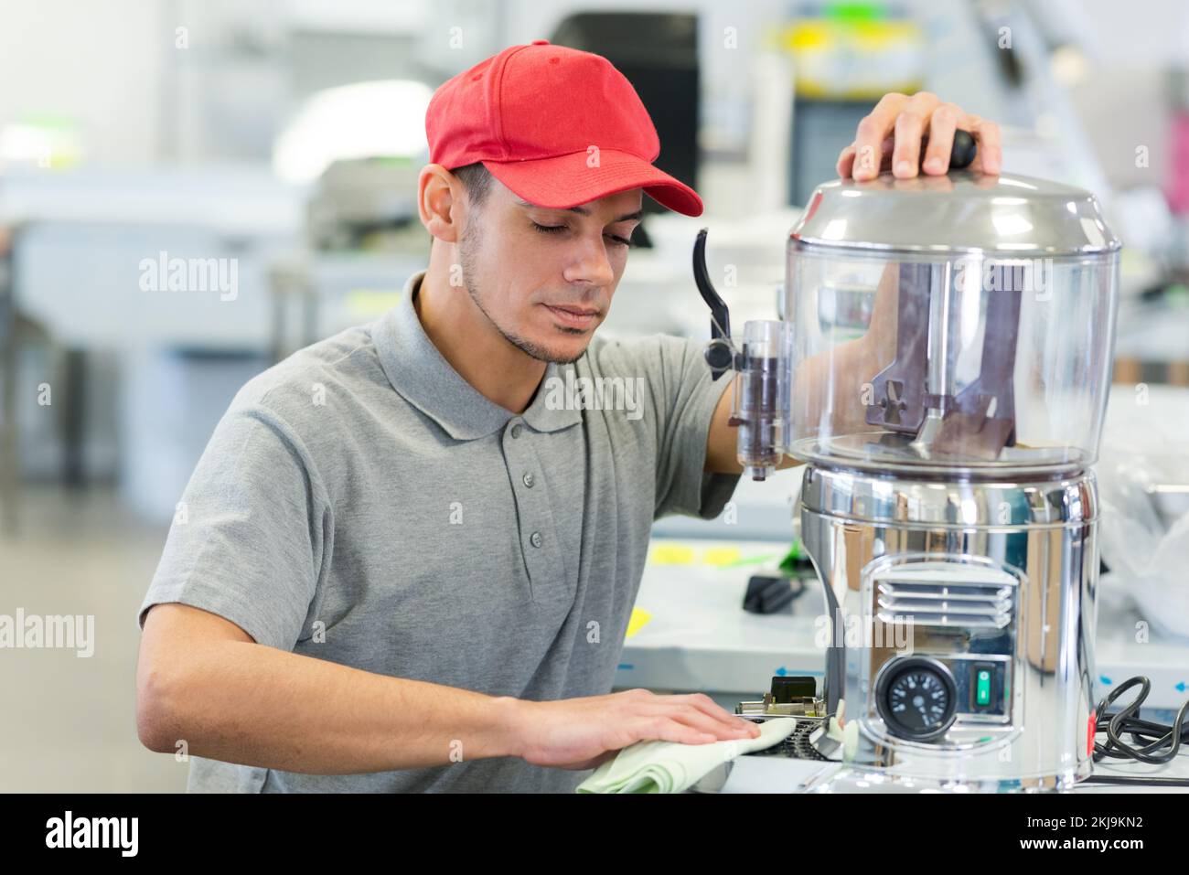 portrait of worker checking a machine Stock Photo - Alamy