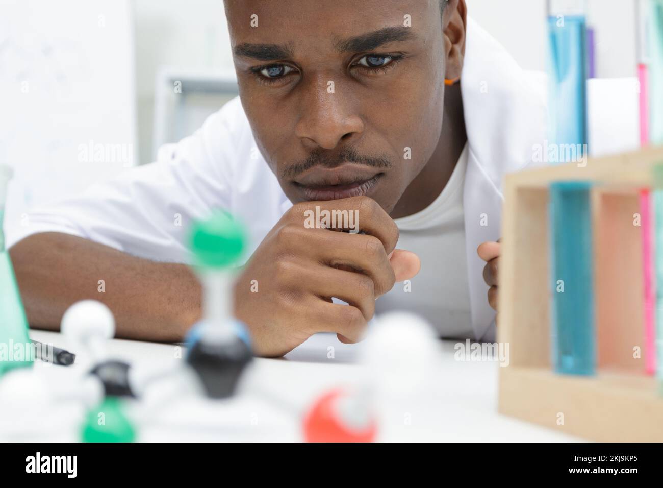 man holding colorful science molecule model Stock Photo - Alamy
