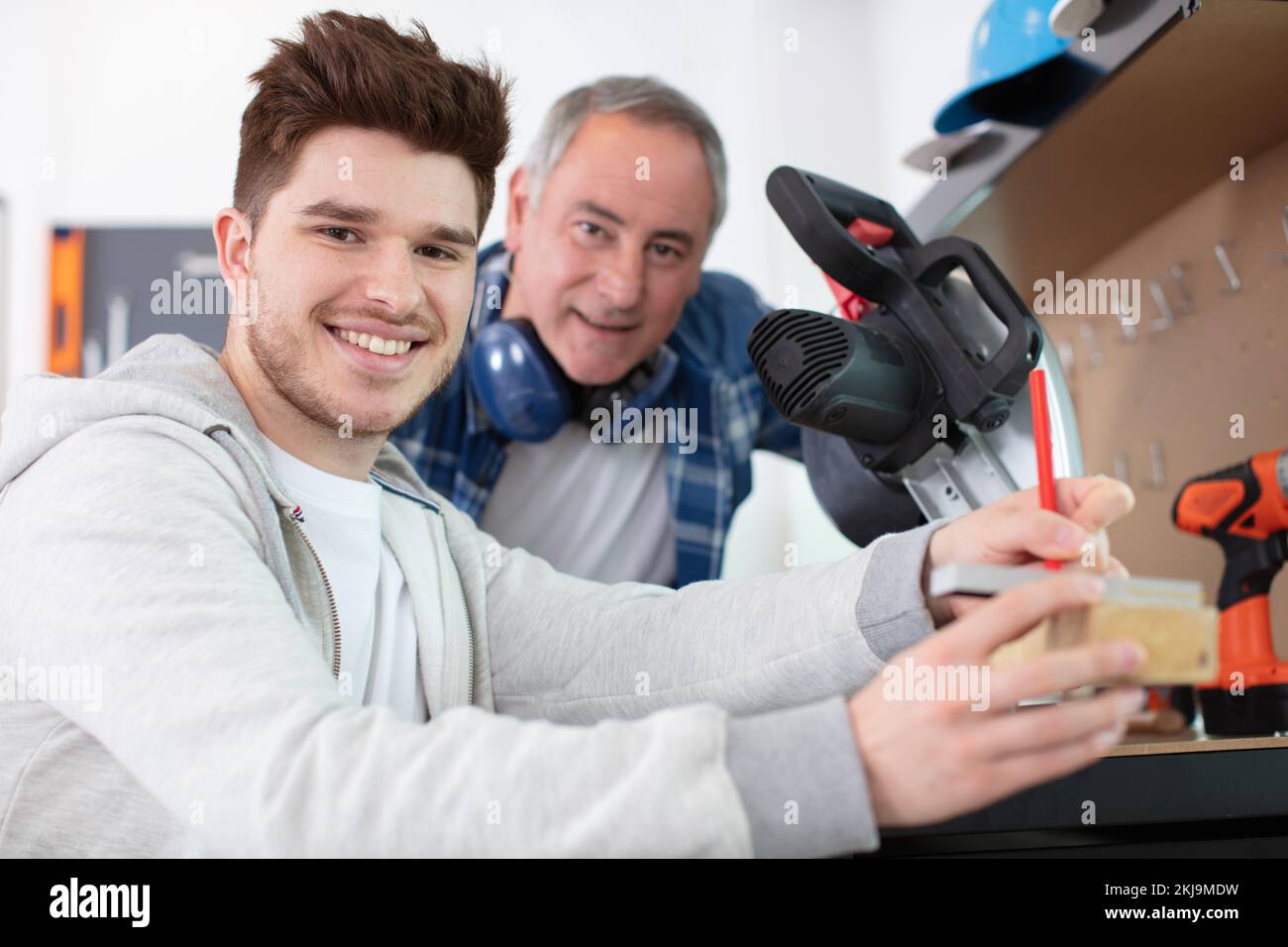 Man during carpenter work assembling hi-res stock photography and ...