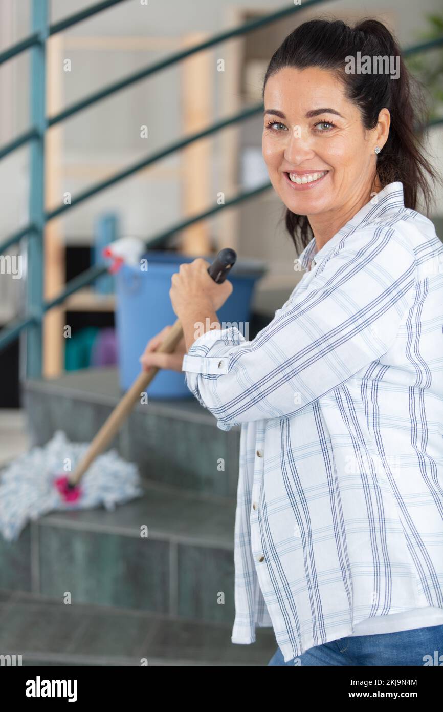Woman mopping stairs hi-res stock photography and images - Alamy
