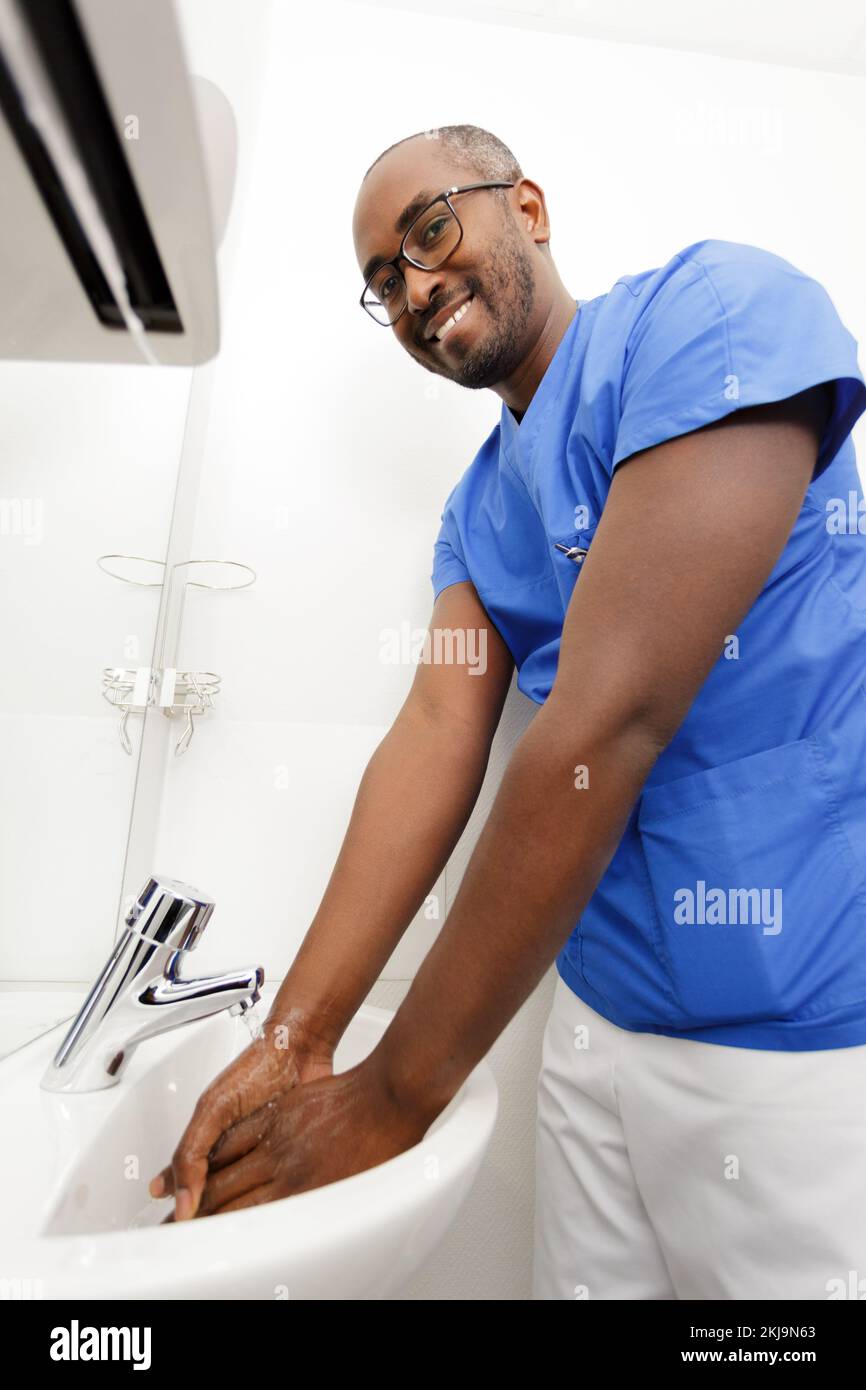 young nurse washing hands with soap isolated Stock Photo - Alamy