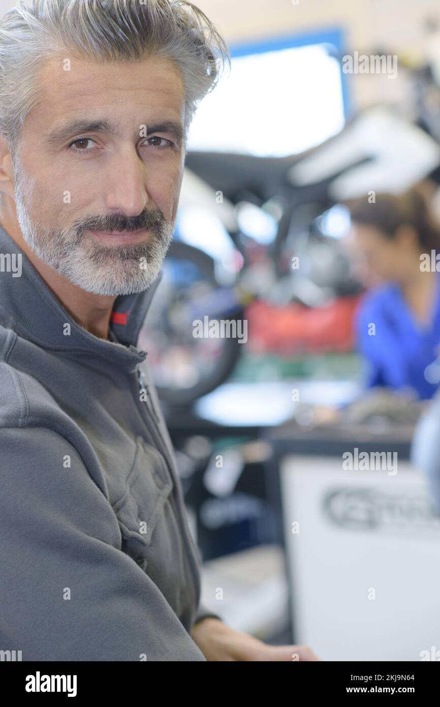auto mechanic checks the operation of the fuel injection Stock Photo ...