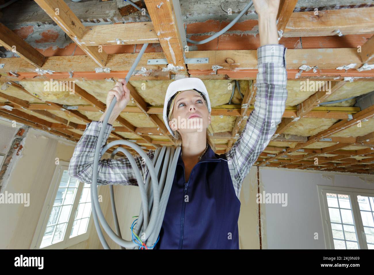 Female electrician fixing wire hi-res stock photography and images - Alamy