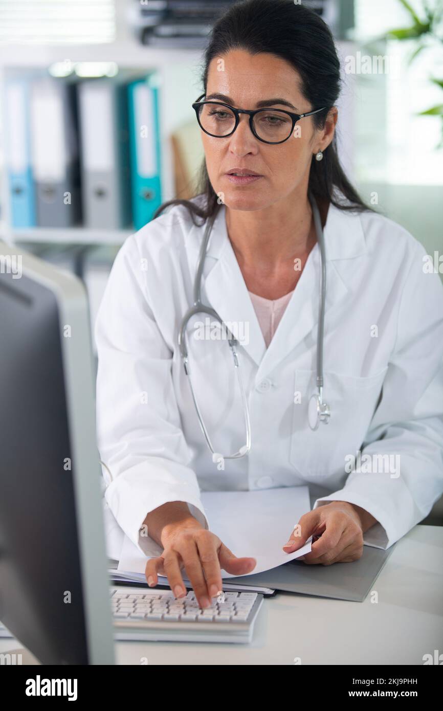 professional female doctor using a computer Stock Photo - Alamy