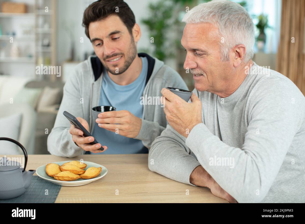 happy two generations men together at home Stock Photo - Alamy