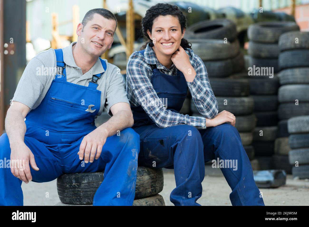 two happy mechanics posing outdoors Stock Photo - Alamy