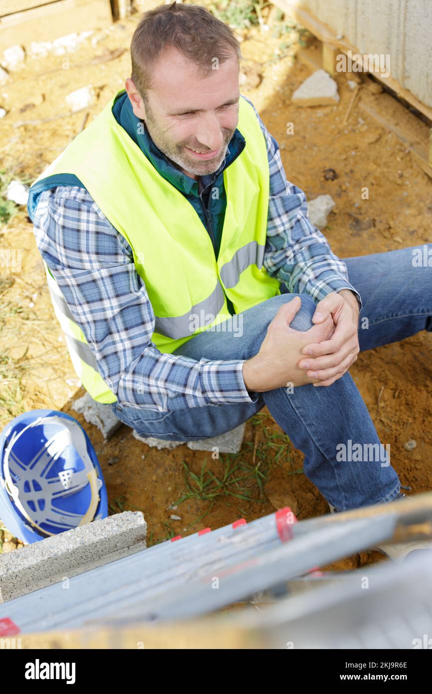 construction worker suffering injury after accident at work Stock Photo ...