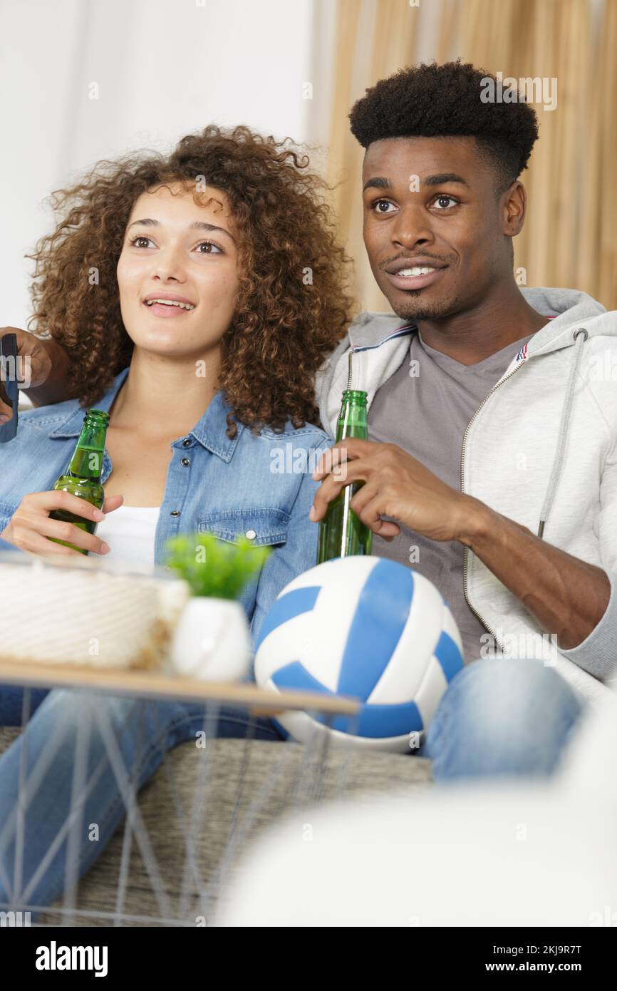 volleyball fan couple watching game Stock Photo - Alamy