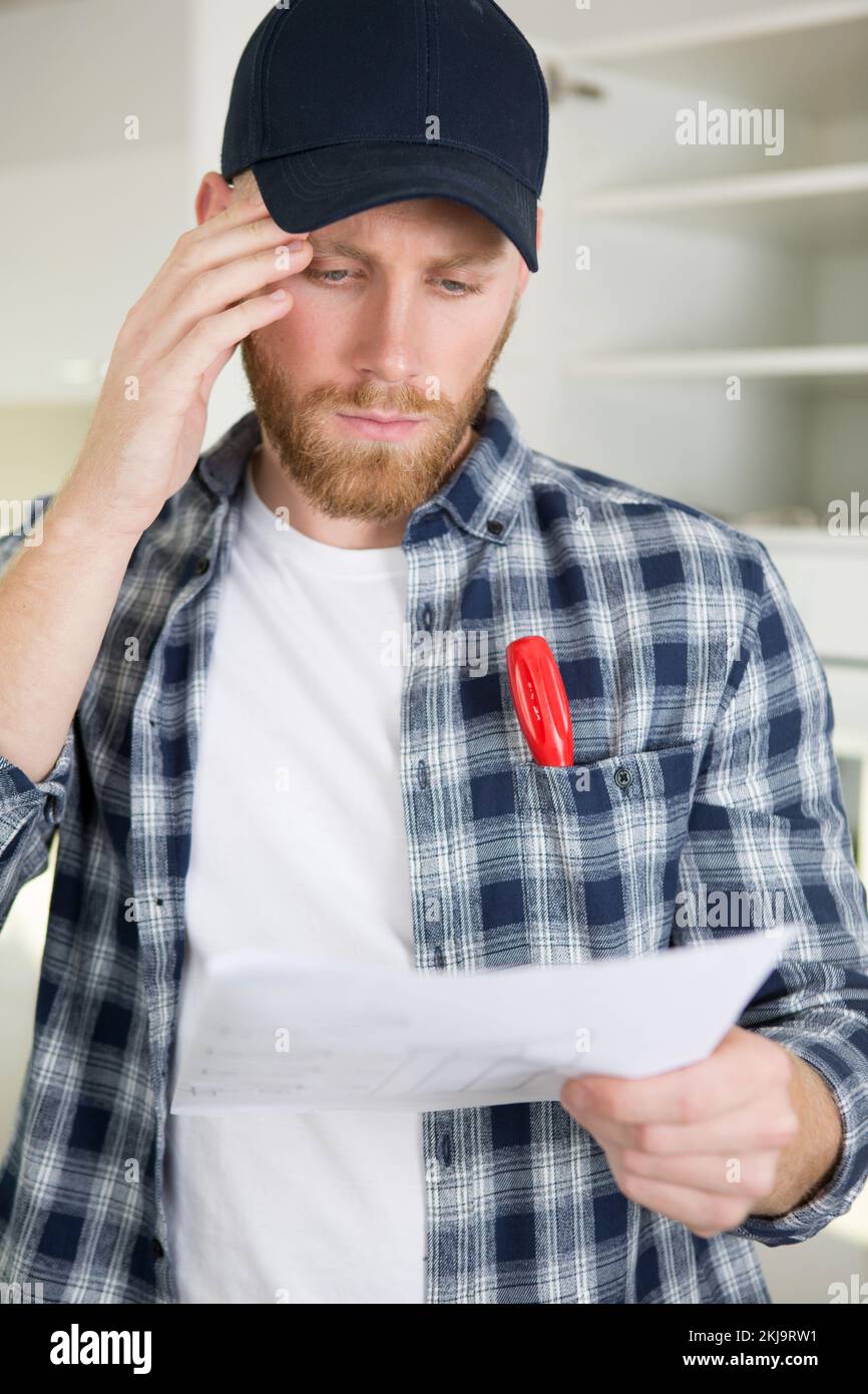 Puzzled builder hi-res stock photography and images - Alamy