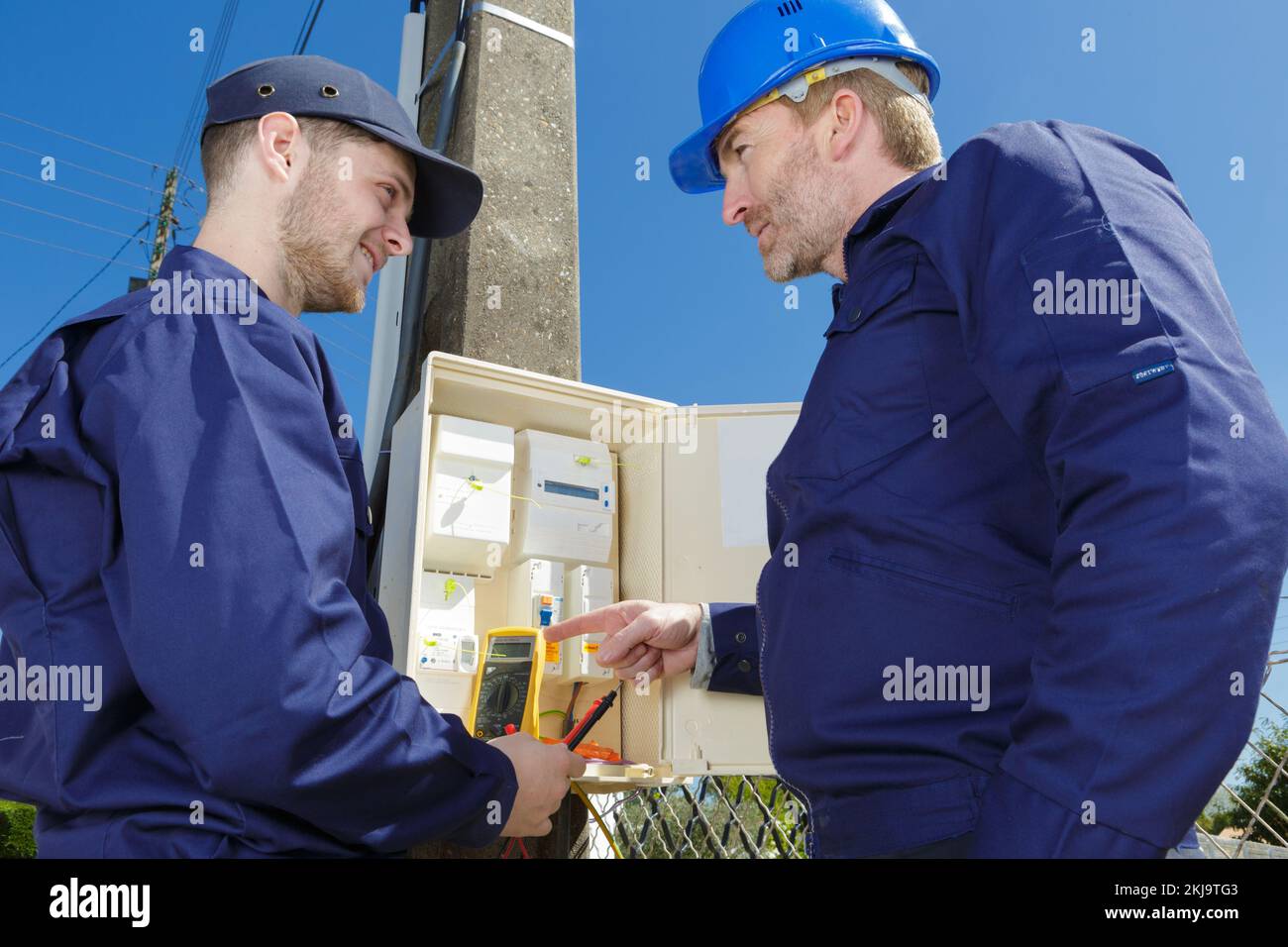 two technicians working on communication towers Stock Photo - Alamy