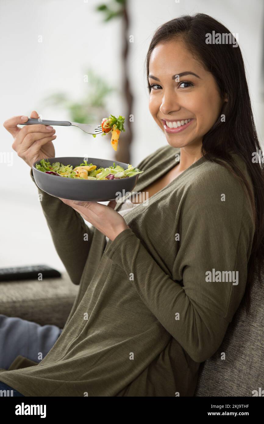 Laughing woman eating healthy outside hi-res stock photography and ...