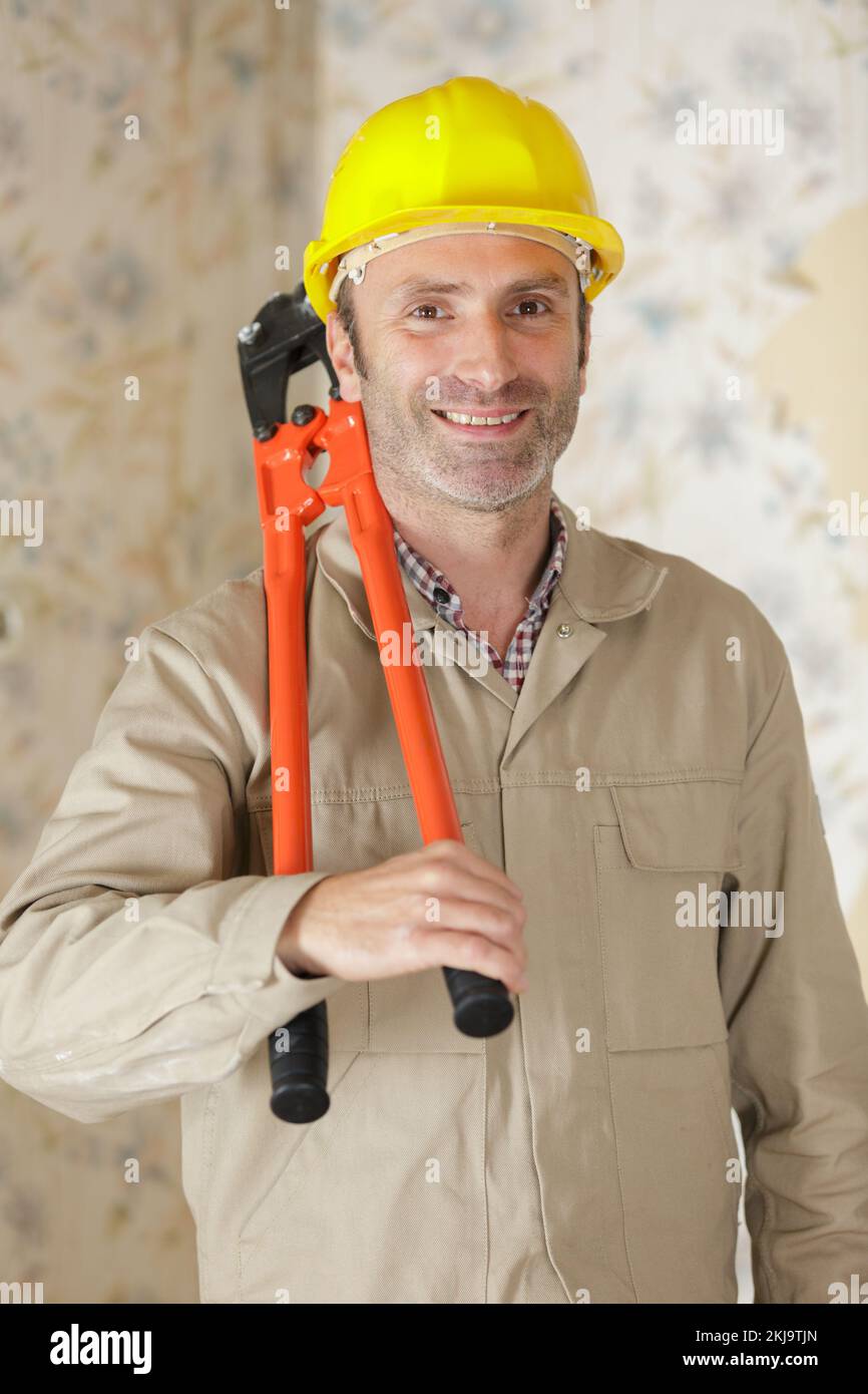 a workman with scissors mower Stock Photo - Alamy