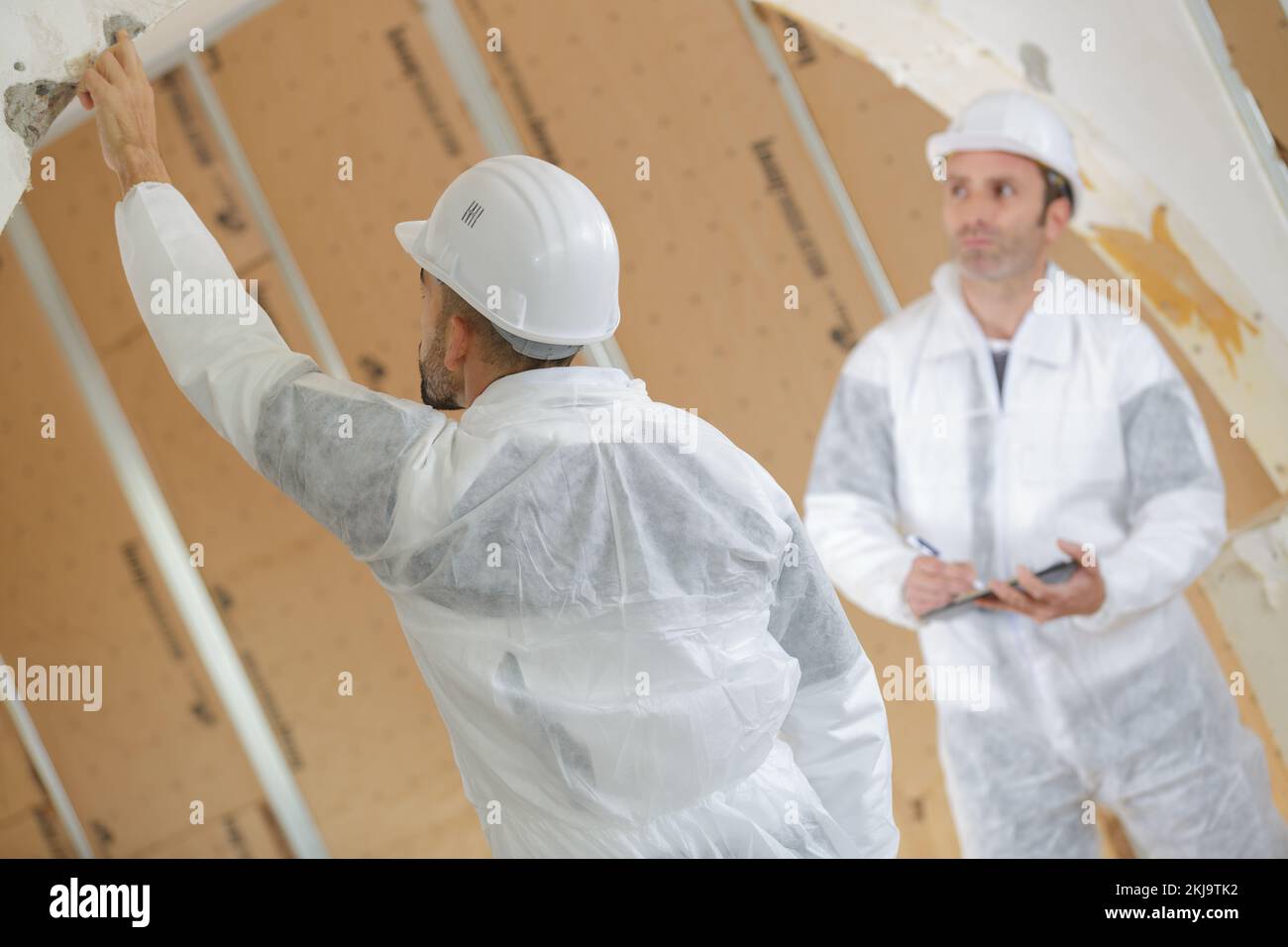 painters at work inside a home Stock Photo - Alamy
