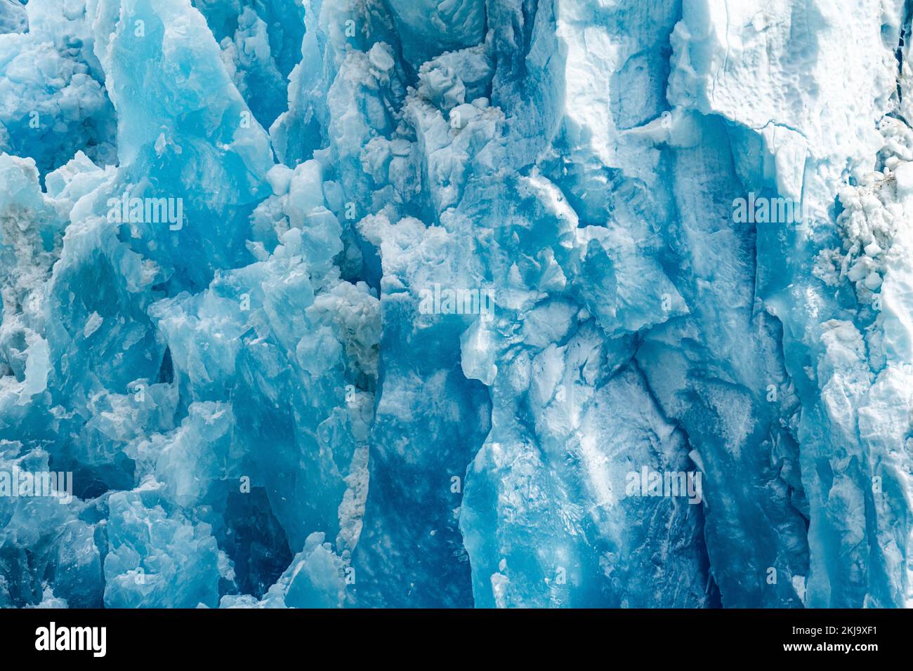 A closeup shot of the ice texture of a blue glacial wall in Inside ...