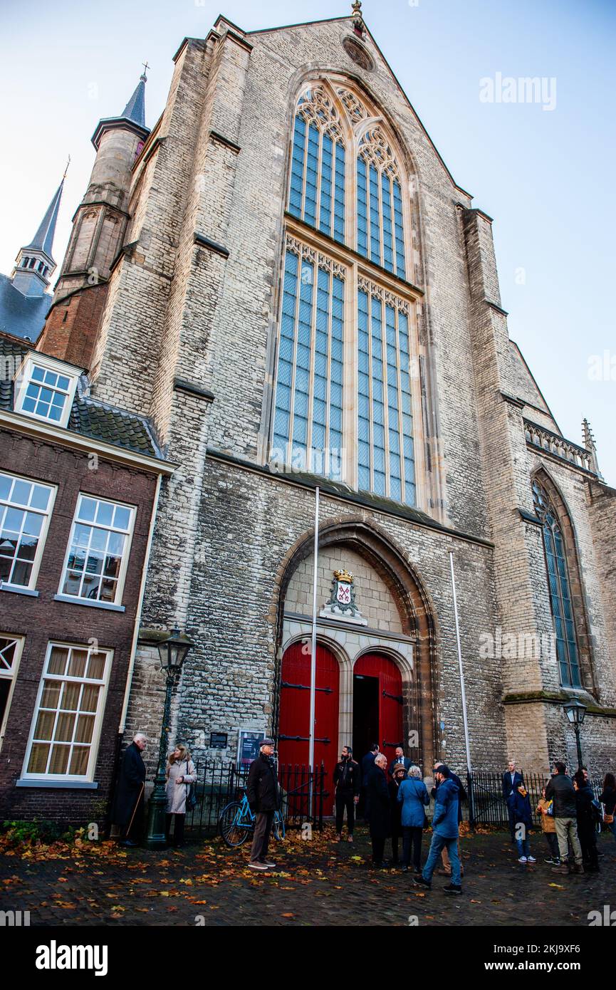 People are seen waiting outside the church before the Service. After ...