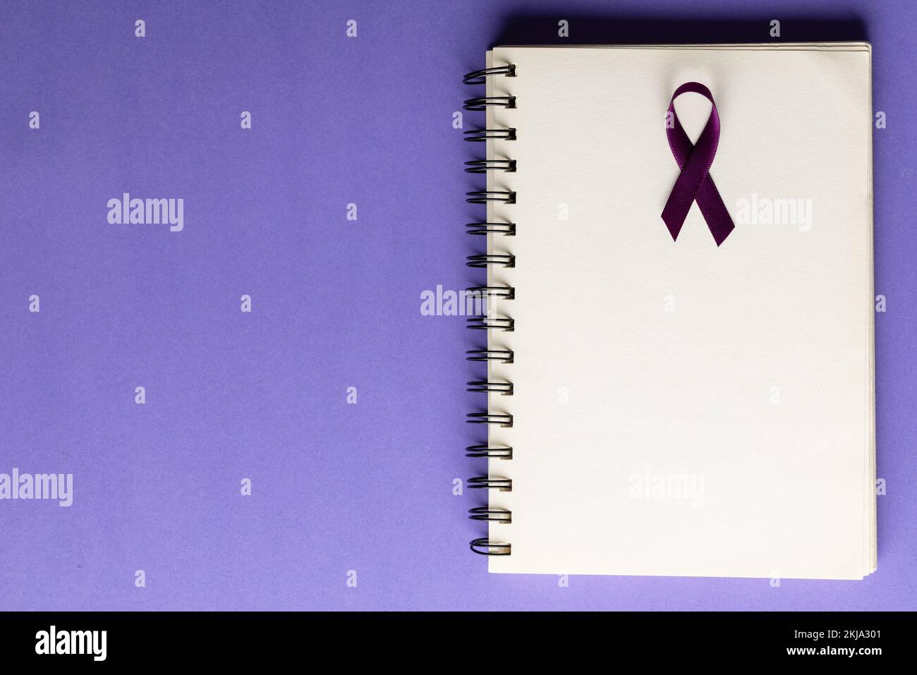 Composition of purple add or adhd awareness ribbon and notebook on ...
