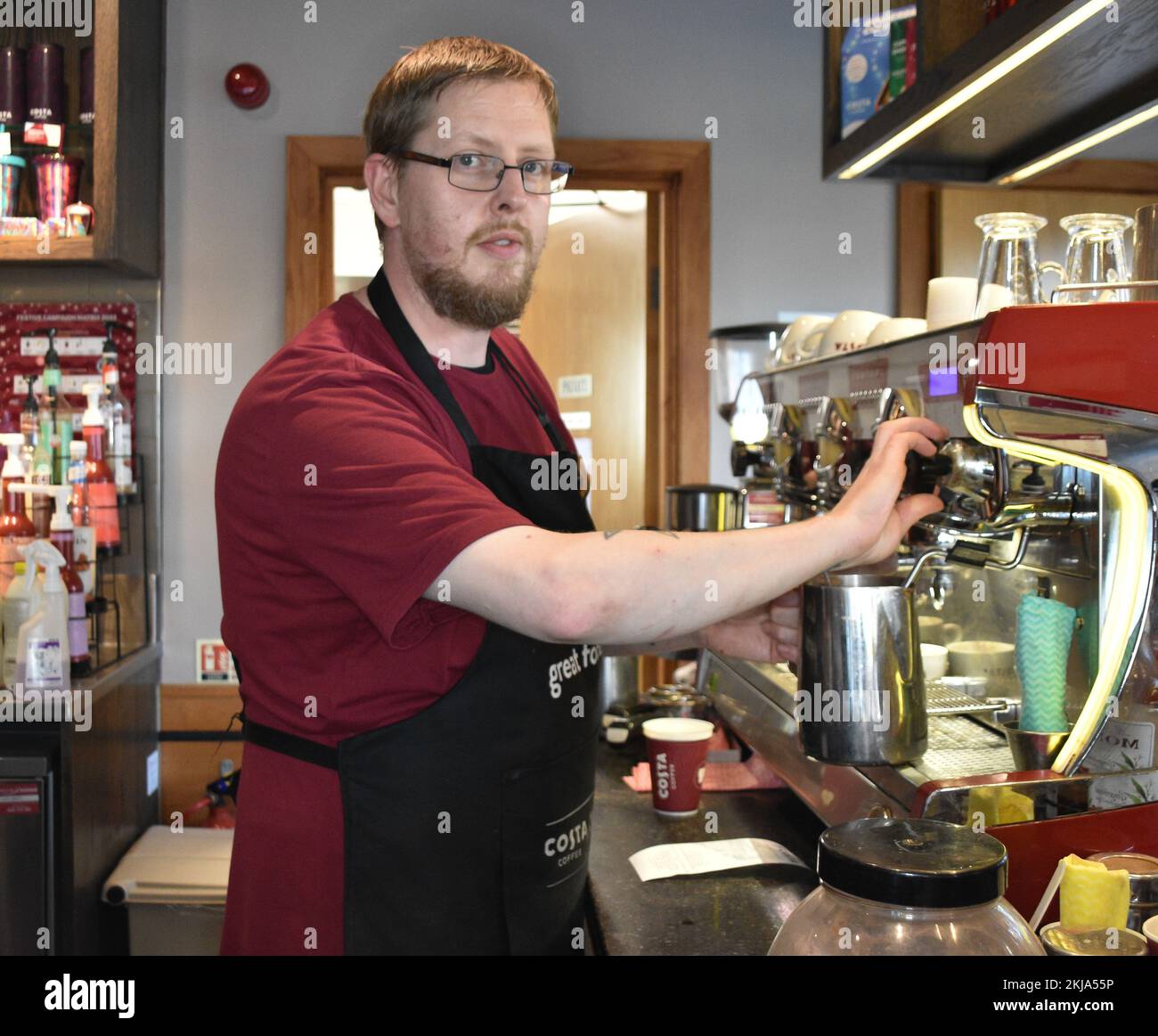 Indoor Portrait Of A Costa Coffee Worker Making Drinks For Customers ...