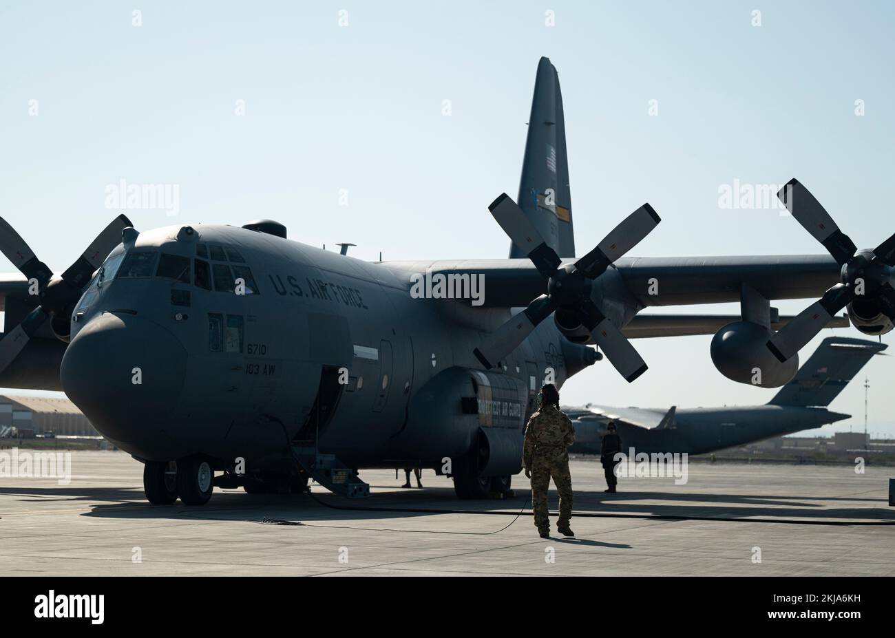 A C-130 Hercules loadmaster assigned to the 75th Expeditionary Airlift Squadron (EAS) prepares ...