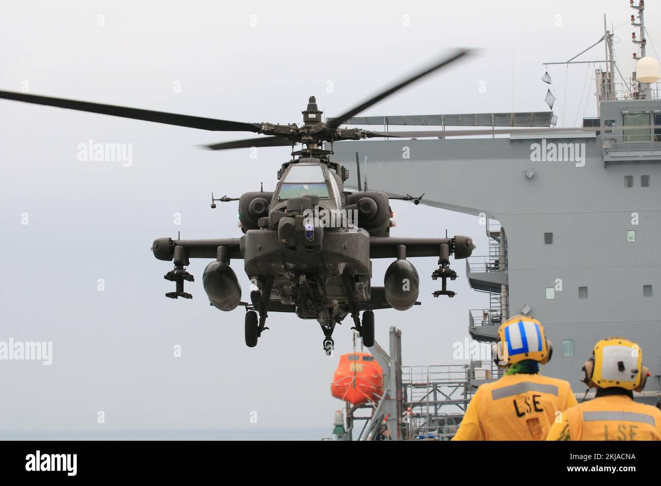 U.S. Navy aviation boatswain's mate (handling) coordinates the arrival ...