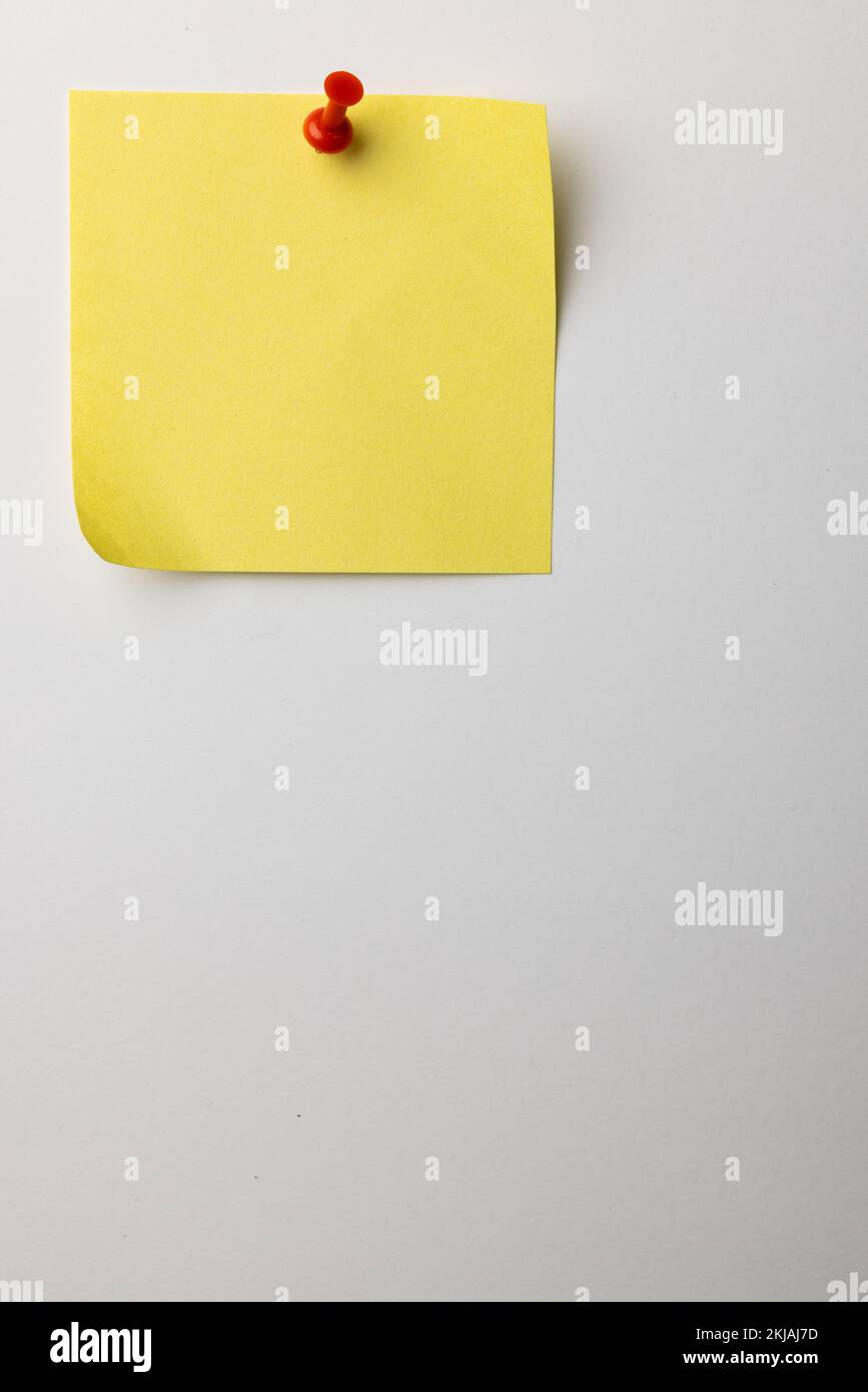 Yellow sticky memo note and copy space on white background Stock Photo ...