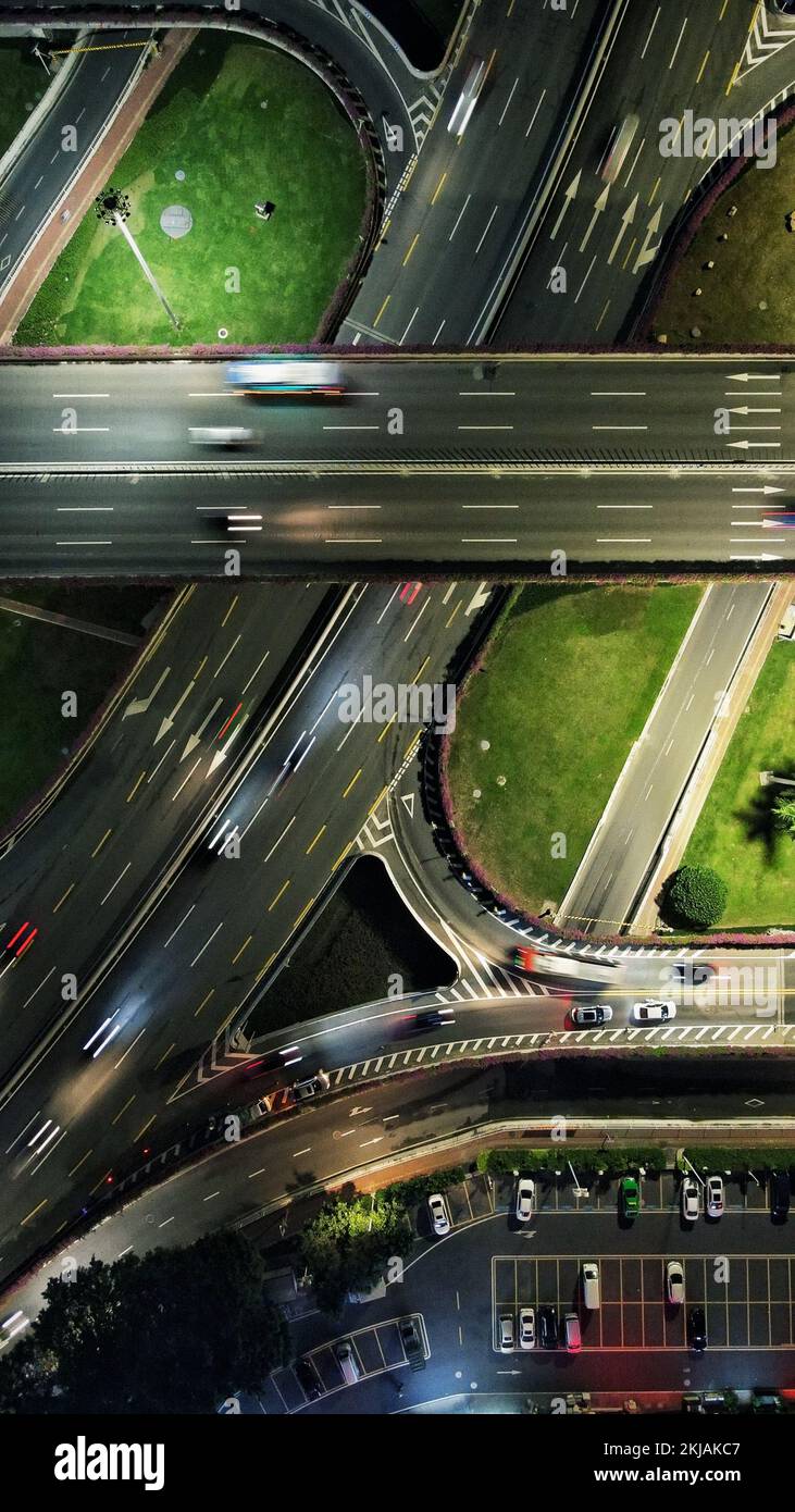 A top view of the evening traffic on elevated roads in vertical Stock ...