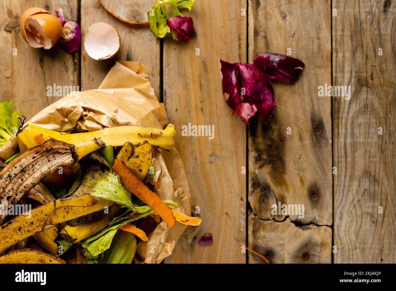 Overhead of organic fruit and vegetable food waste spilling from full ...