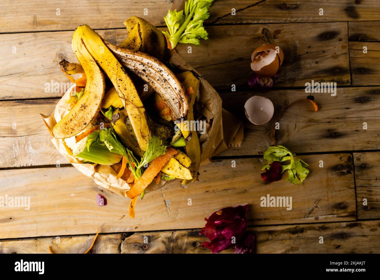 Overhead of organic fruit and vegetable food waste spilling from full ...