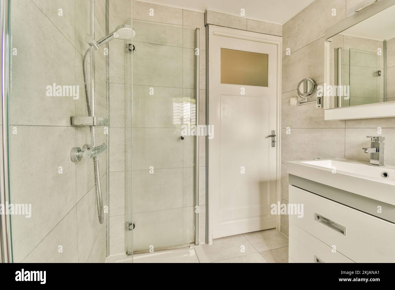 Glass partition between shower tap and wall hung toilet in modern ...