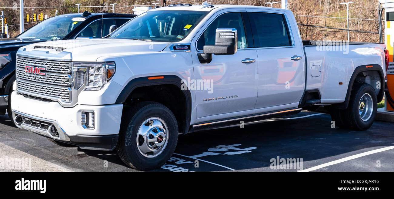A white four door GMC dually pickup truck for sale at a dealership in ...