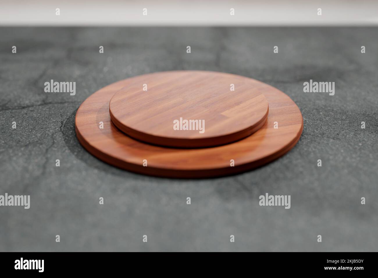 A wood platter round stage on top of hardwood counter Stock Photo - Alamy