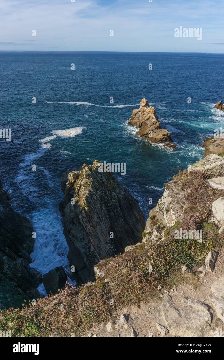 Rocks at the coastline of Pointe du Raz with view at the atlantic ocean ...