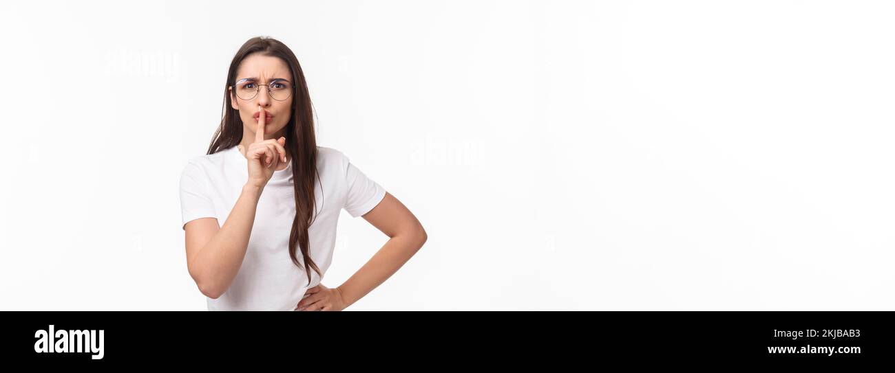 Waist-up portrait of angry and disappointed, serious-looking brunette ...