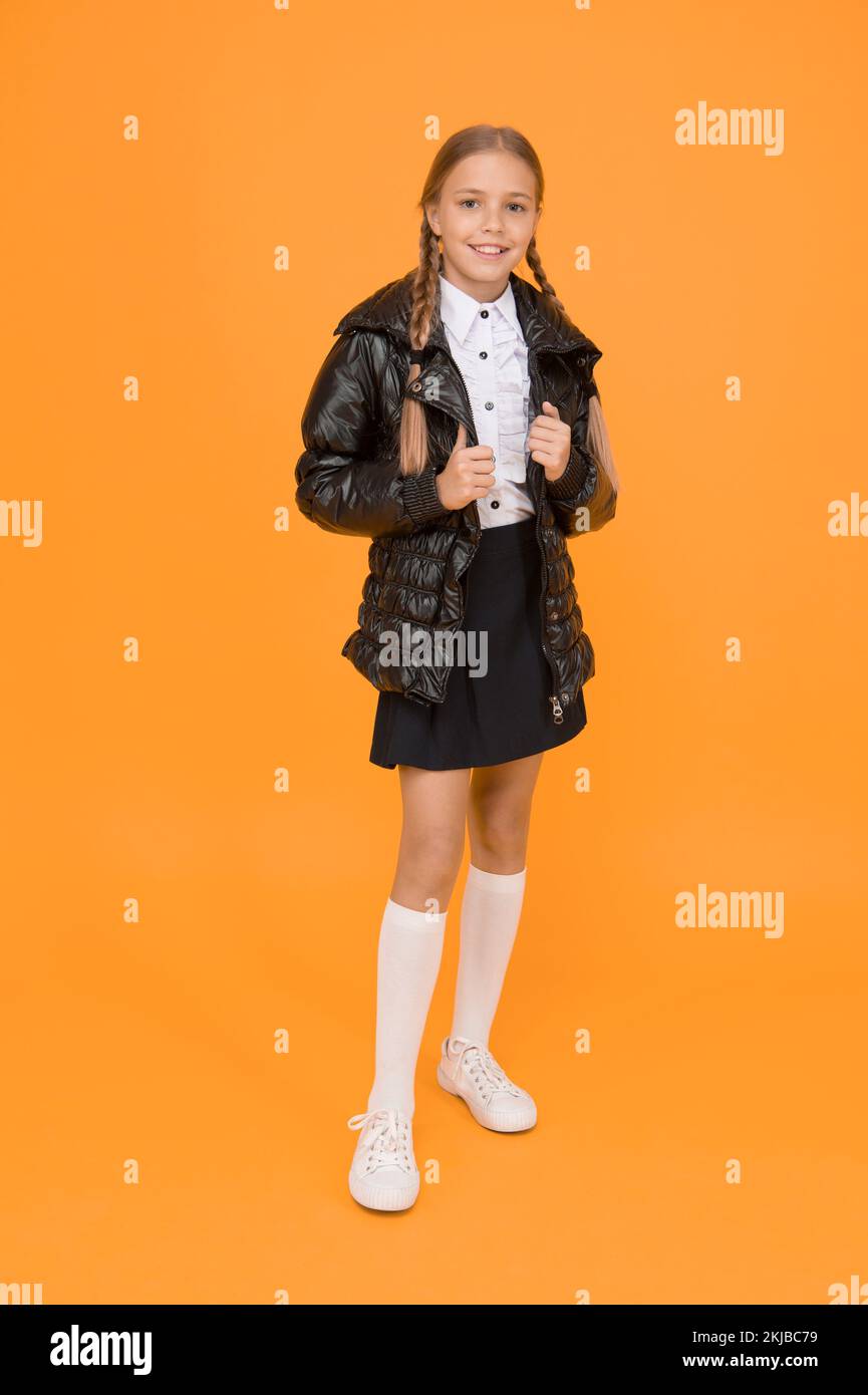 Fashion shop. Cute girl wear black jacket on yellow background. Fashion ...