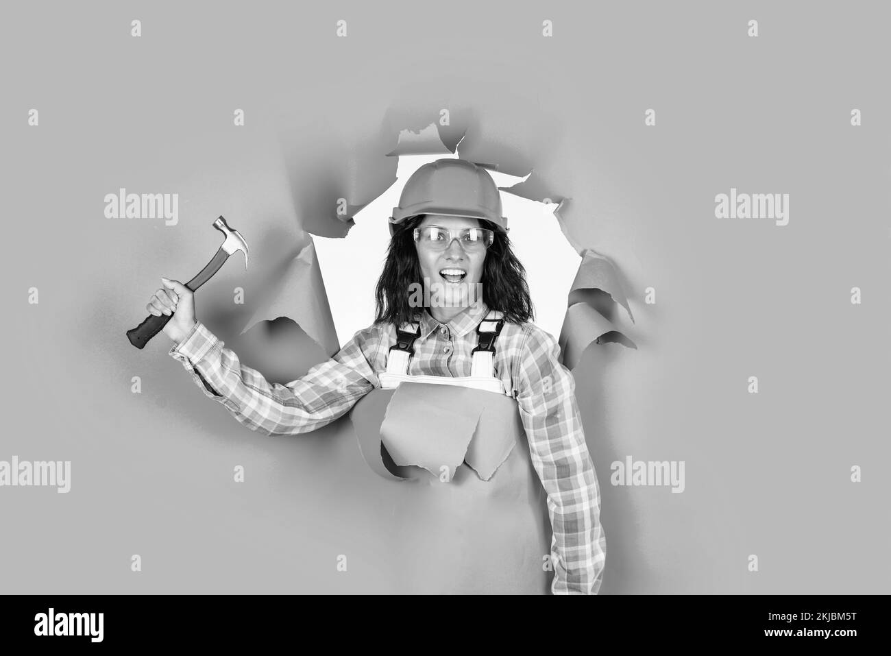 fine homebuilding. architect working with hammer. female foreman on ...