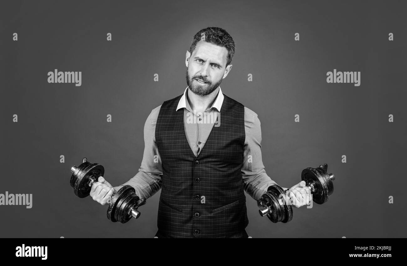 Strong man employee dumbbell Black and White Stock Photos & Images - Alamy