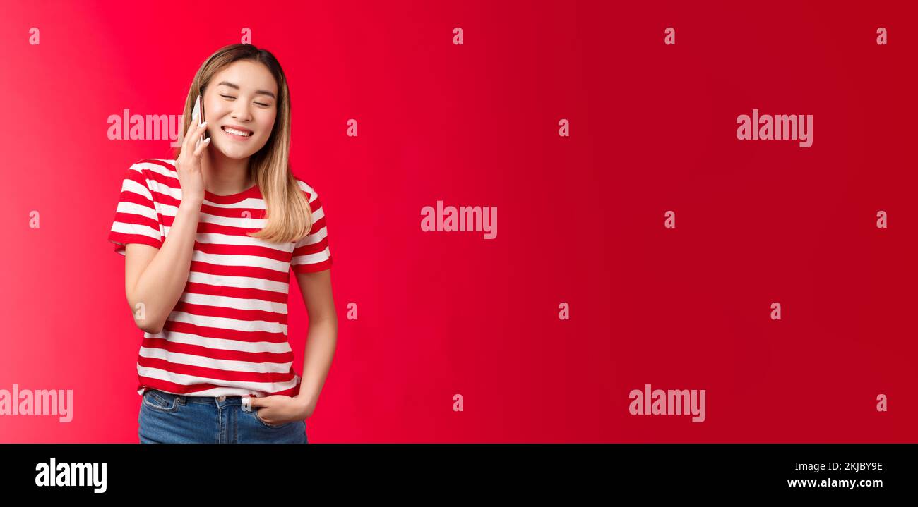 Carefree friendly good-looking blond asian girl having funny ...