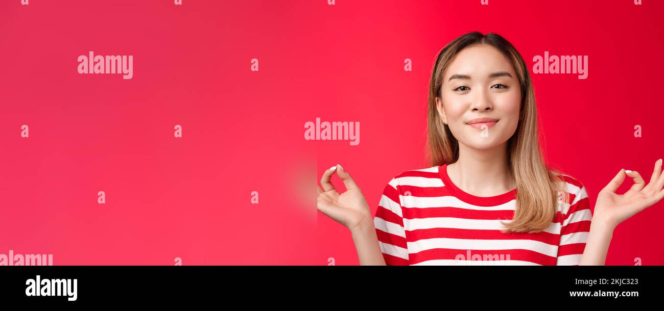 Peaceful happy relaxed asian woman meditating, hold hands zen show orbs ...