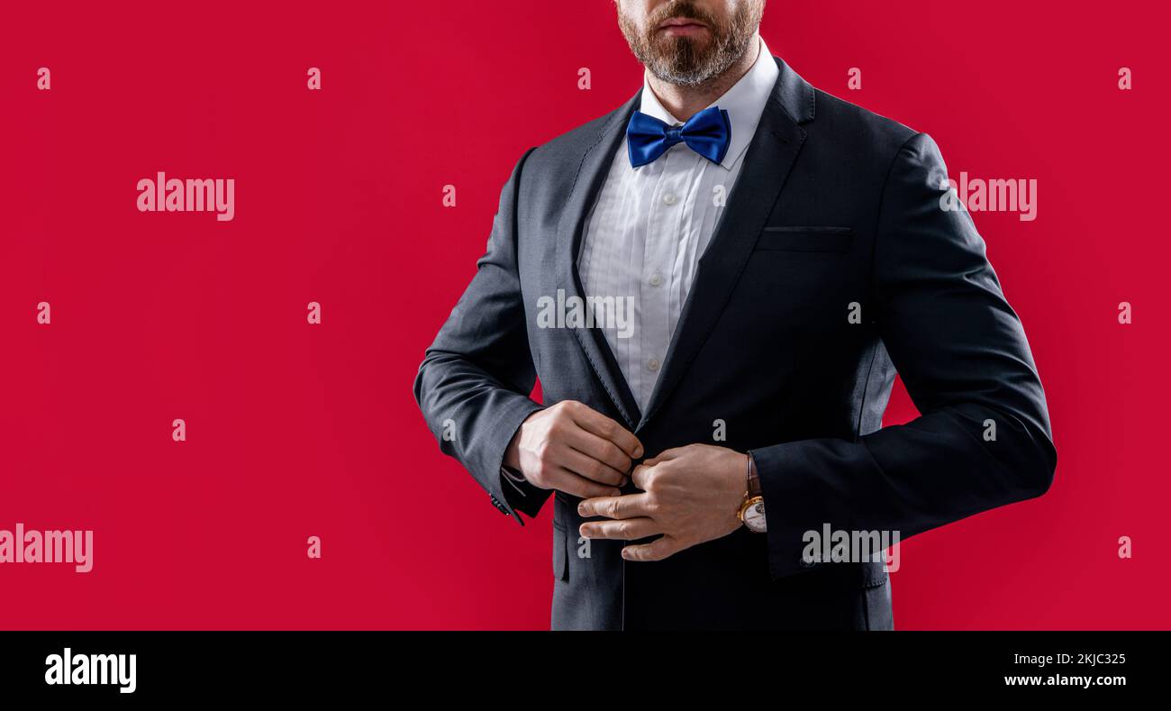 man in tux isolated on red background, copy space. tux man in studio ...