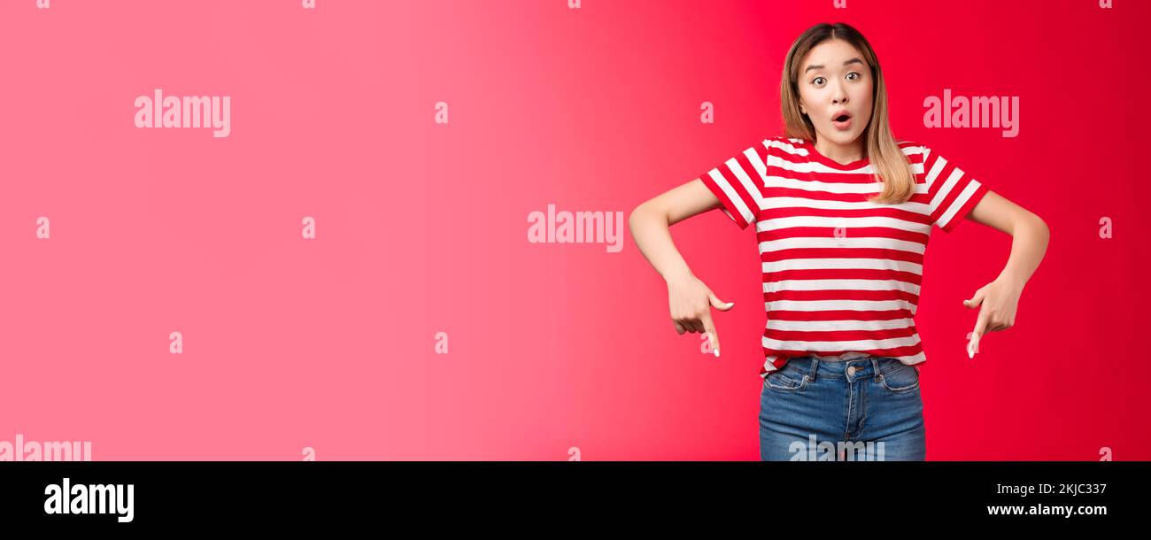 Wow look at that. Impressed interested asian blond female customer ...