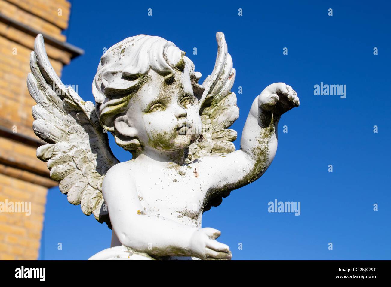 Guardian angel statue in light as a symbol of strength, truth and faith ...