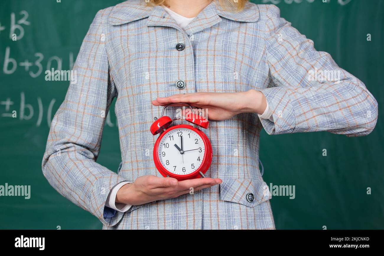 School discipline concept. Schedule and regime. Alarm clock in female ...