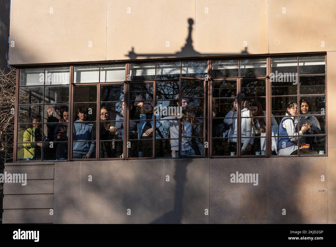 People watching through the windows of residential building 96th Macy's ...