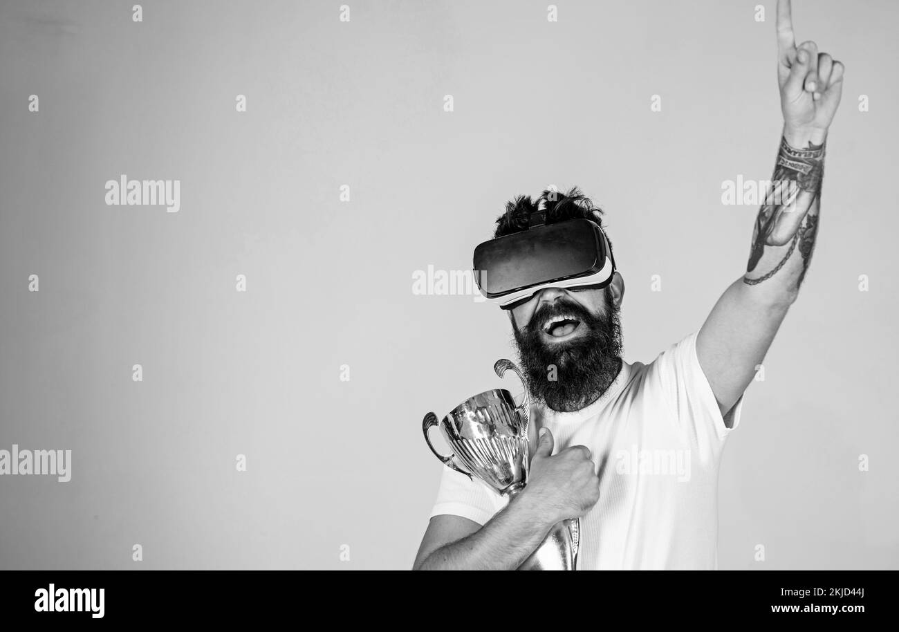 Guy with head mounted display won in virtual game. Man with beard in ...