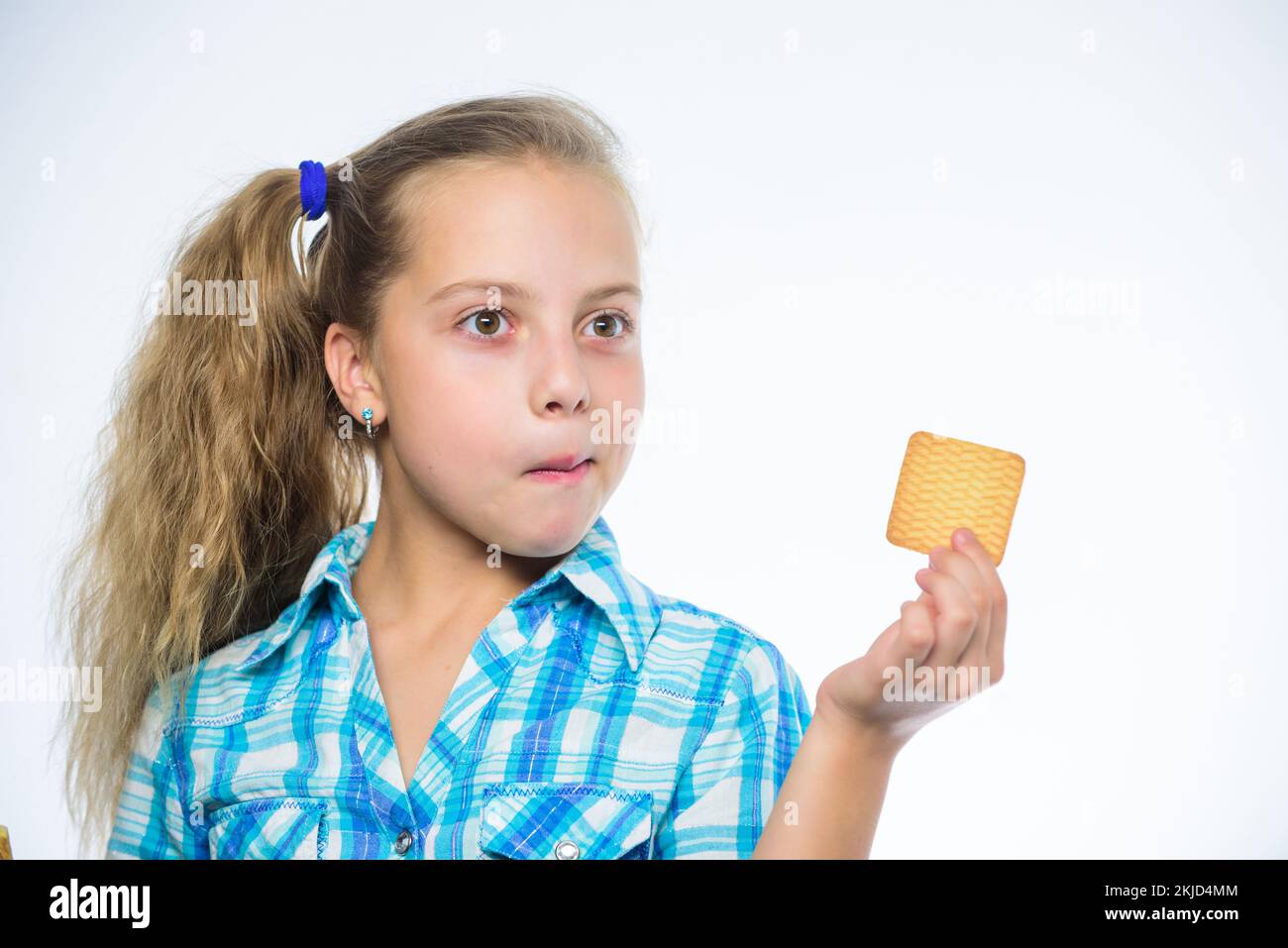 little chef tasting cookie. little girl with cookie. happy childhood ...