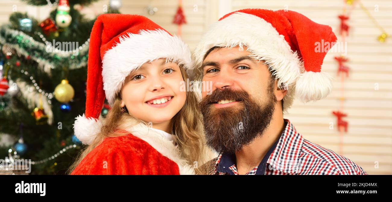 Close up portrait of Father with daughter near christmas tree at home ...
