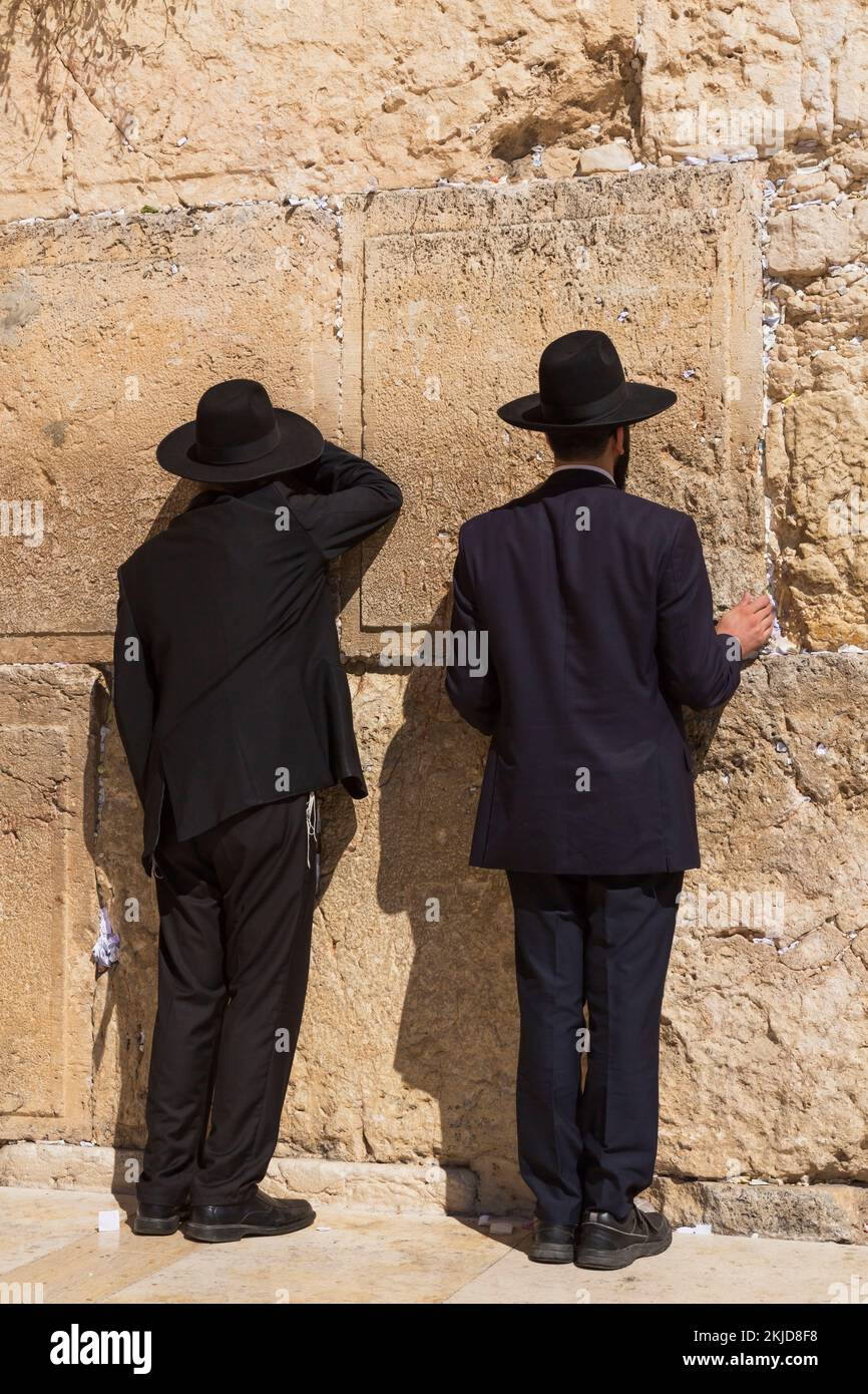 Jewish orthodox men praying at the Western Wall Plaza or Wailing Wall ...
