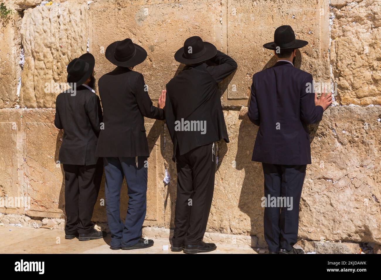 Jewish orthodox men praying at the Western Wall Plaza or Wailing Wall ...