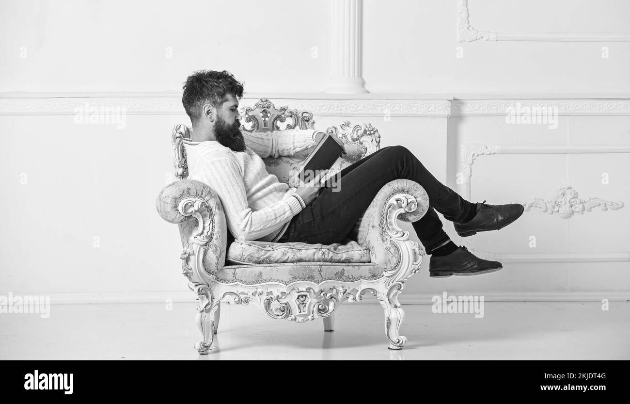 Intelligent concept. Macho smart spends leisure with book. Scientist ...