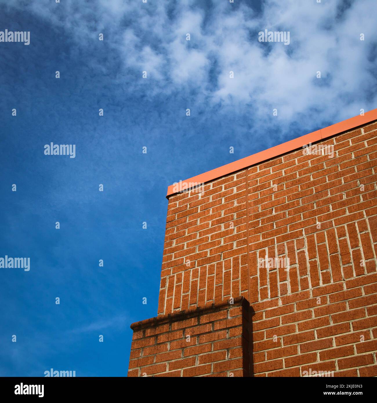 A brown long brick wall pattern on a building Stock Photo - Alamy